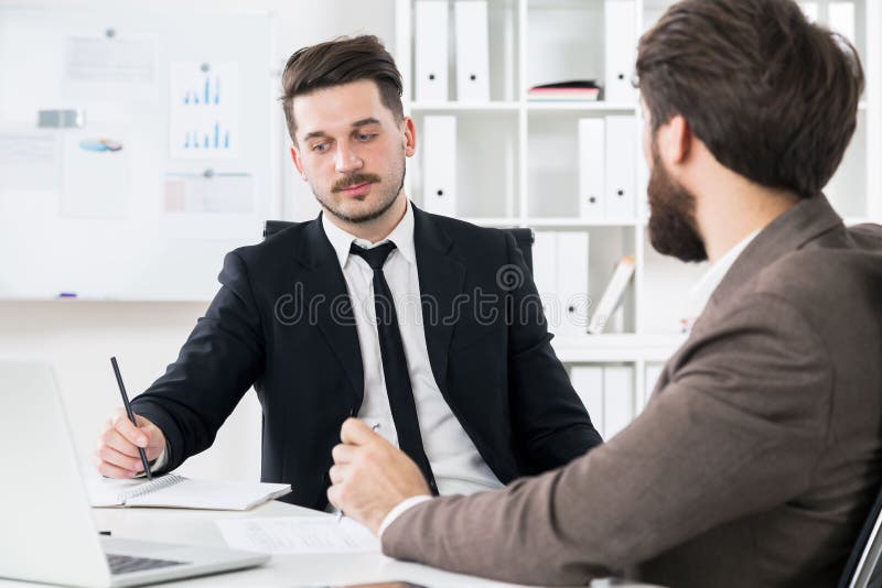 Successful Businessmen Discussing Something Stock Photo - Image of male ...