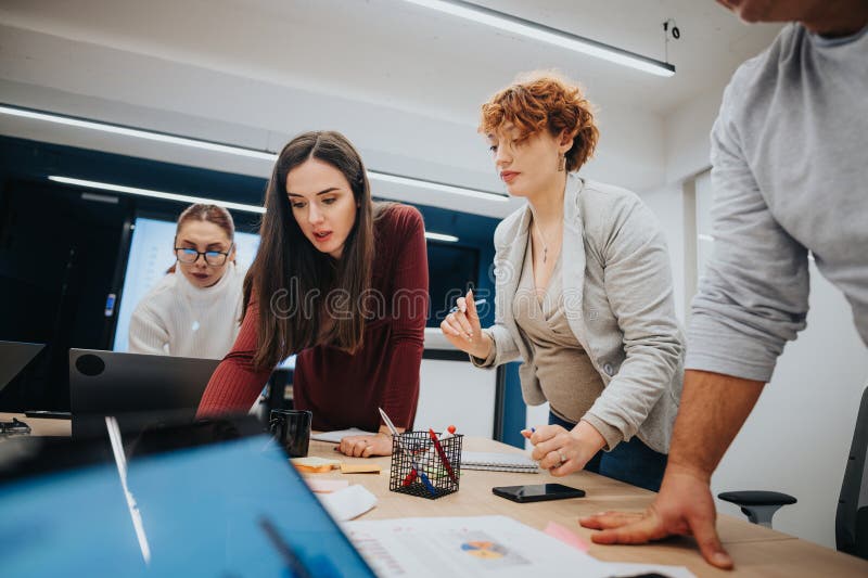 Successful Businesspeople Collaborating and Sharing Ideas in a Dynamic Workshop Stock Photo ...