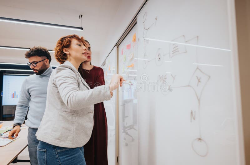 Successful Collaboration. Multiracial Team Brainstorming and Analyzing Statistics in Business ...