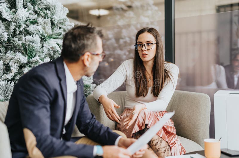 Business Owners Collaborating, Discussing Project Details and ...