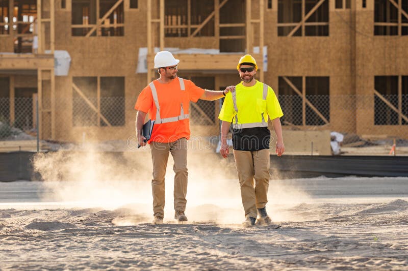 Successful Construction Site Workers with Builders Equipment ...