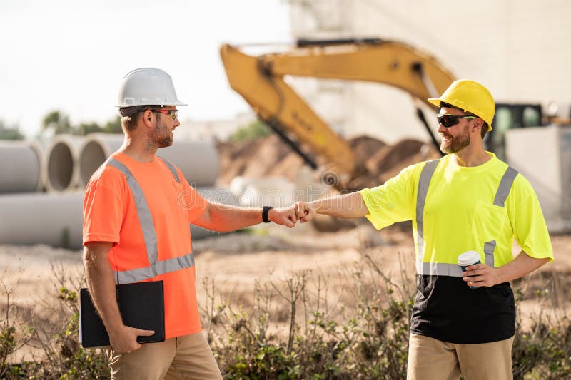 Successful Construction Site Workers with Builders Equipment ...
