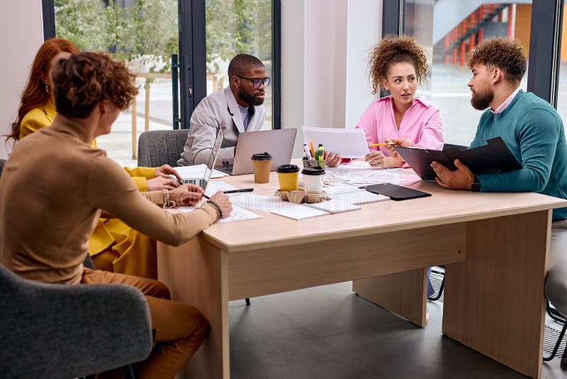 Successful Cooperation of Diverse Business People Gathered To Work on ...