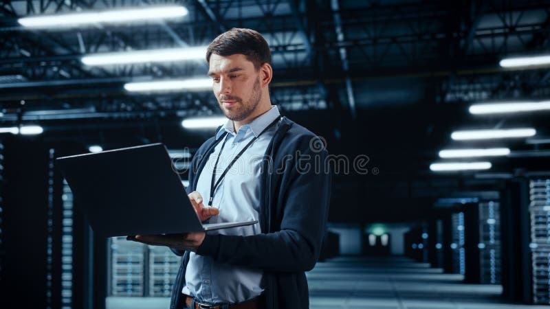 Successful Data Center it Specialist Using Laptop Computer. Server Farm ... Successful Data Center it Specialist Using Laptop Computer. Server Farm ...