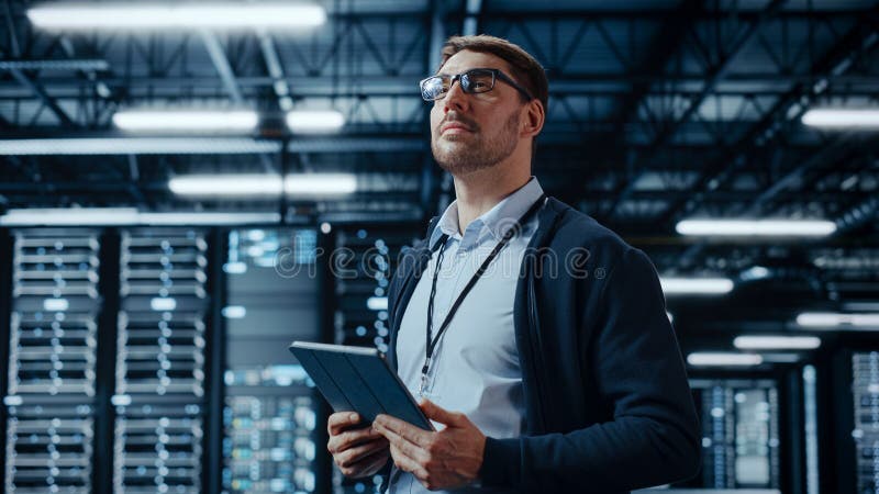 Successful Data Center it Specialist Using Tablet Computer. Server Farm ...