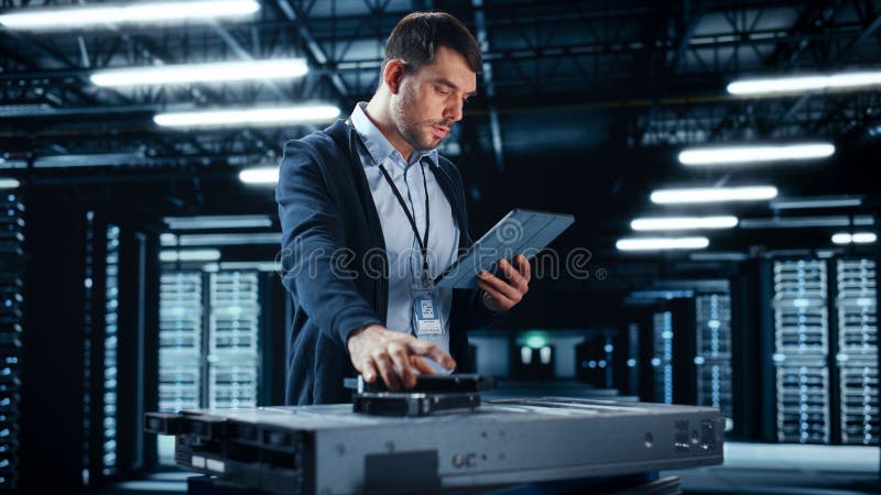 Successful Data Center it Specialist Using Tablet Computer. Server Farm ... Successful Data Center it Specialist Using Tablet Computer. Server Farm ...