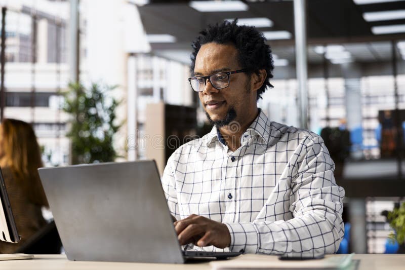 Successful Entrepreneur Working on Financial Forecasts at His Desk ...