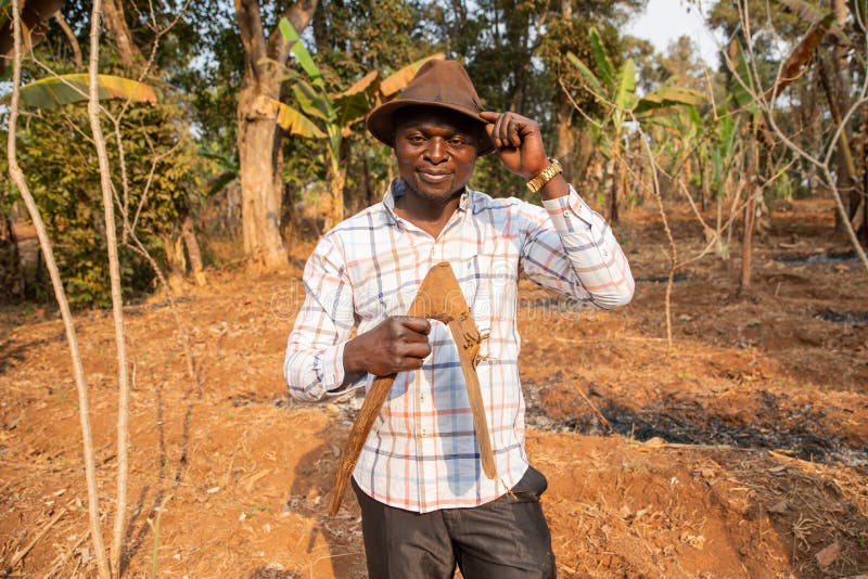 Successful Farmer in His Field Holds the Hoe in His Hand Stock Photo ...