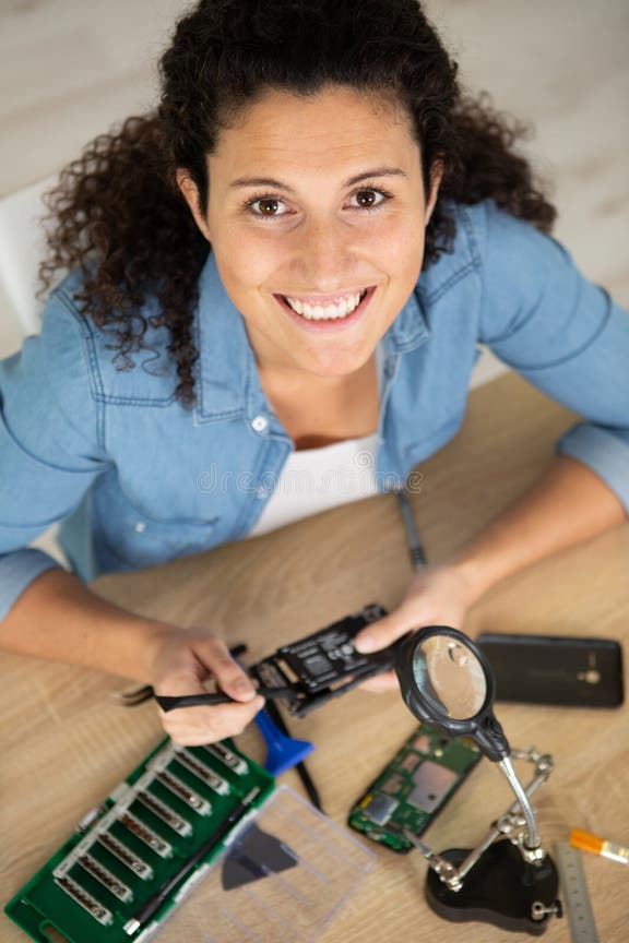 Successful Female Computer Technician Smiles at Camera Stock Photo ...
