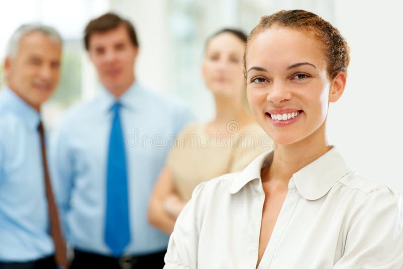 Successful Female Executive with Her Team in Background. Successful ...