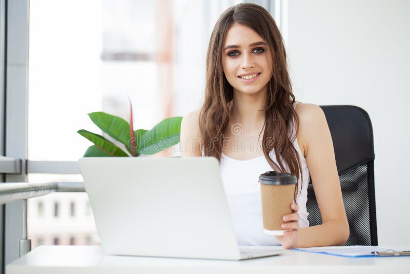Successful Female Working a Laptop Computer in Office. Stock Image ...