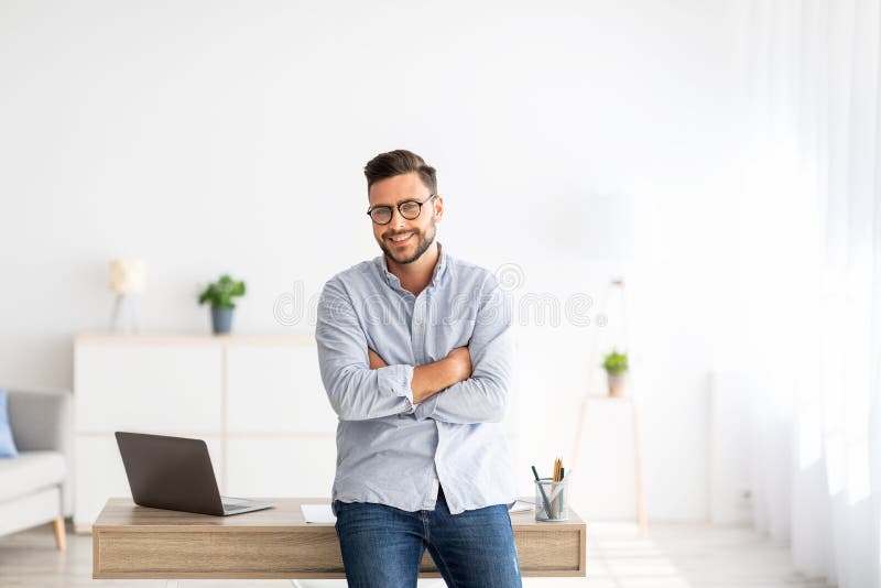 Successful Freelancer Man Standing at Desk at Home Office Interior ...