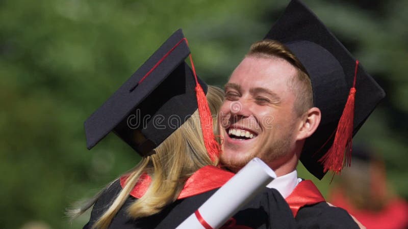 Successful Graduating Students Hugging and Laughing Cheerfully ...