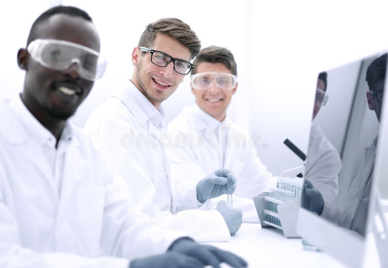 Successful Group of Scientists Sitting at Their Desk Stock Image ...