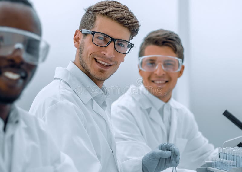 Successful Group of Scientists Sitting at Their Desk Stock Image ...