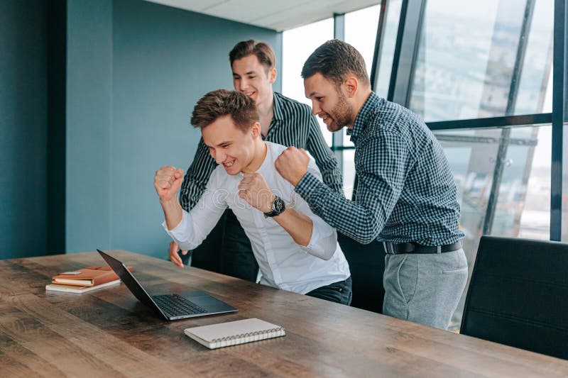 Successful Group of Three Men with Laptops in the Office Stock Image ...