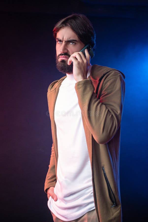 A Successful Guy Talks on the Phone Showing Emotions Stock Image ...