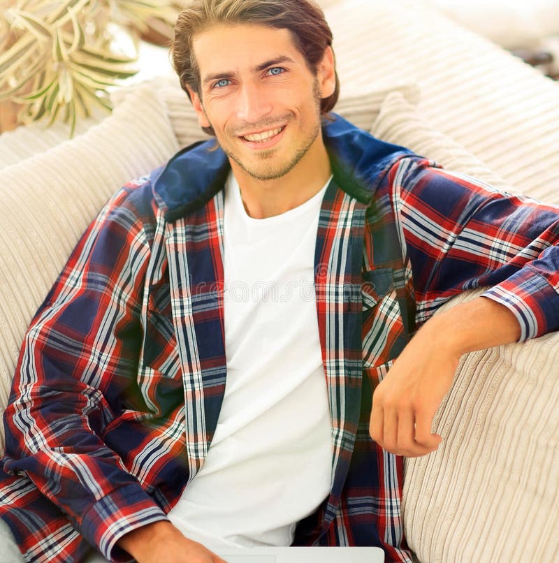 Successful Guy Working on Laptop and Looking at Camera. View from Above ...