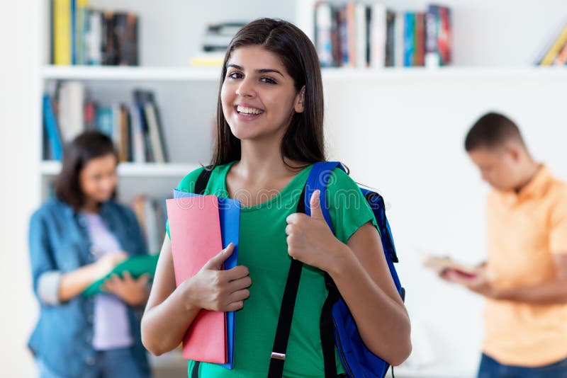 Successful Hispanic Female Student with Group of Young Adults Stock ...