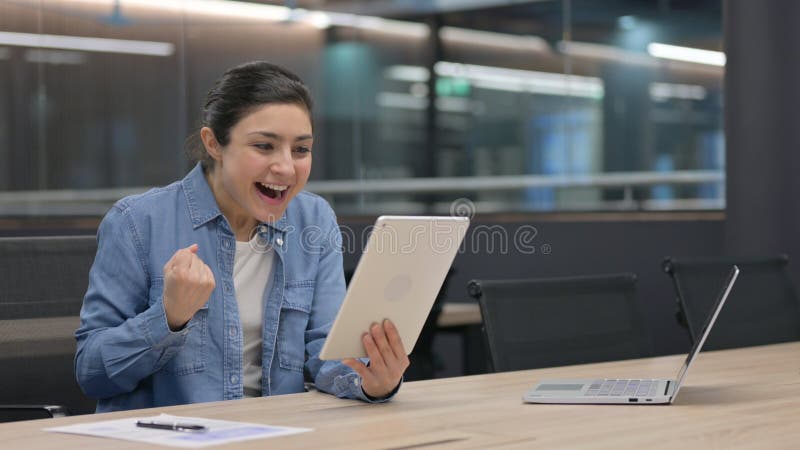 Successful Indian Woman Celebrating on Tablet at Work Stock Photo ...