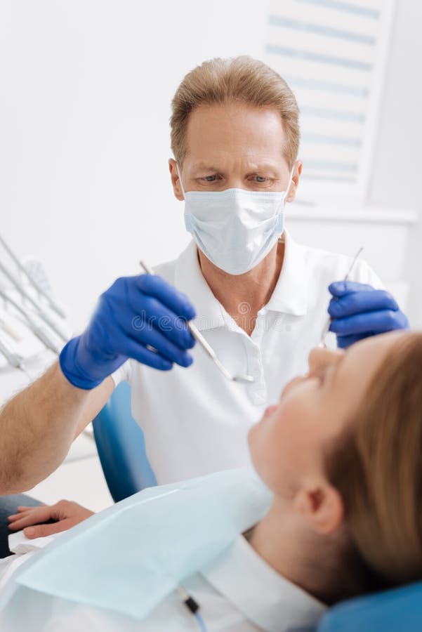 Successful Local Expert Performing a General Checkup Stock Photo ...