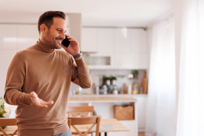 Successful Male Professional Looking Away and Explaining Over Phone ...