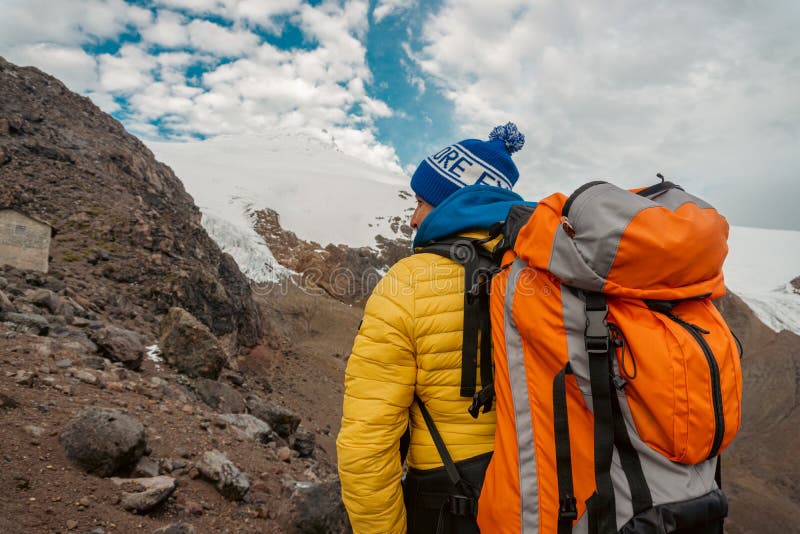 Man Hiker with Backpack in Front of a Mountain Stock Photo - Image of ...