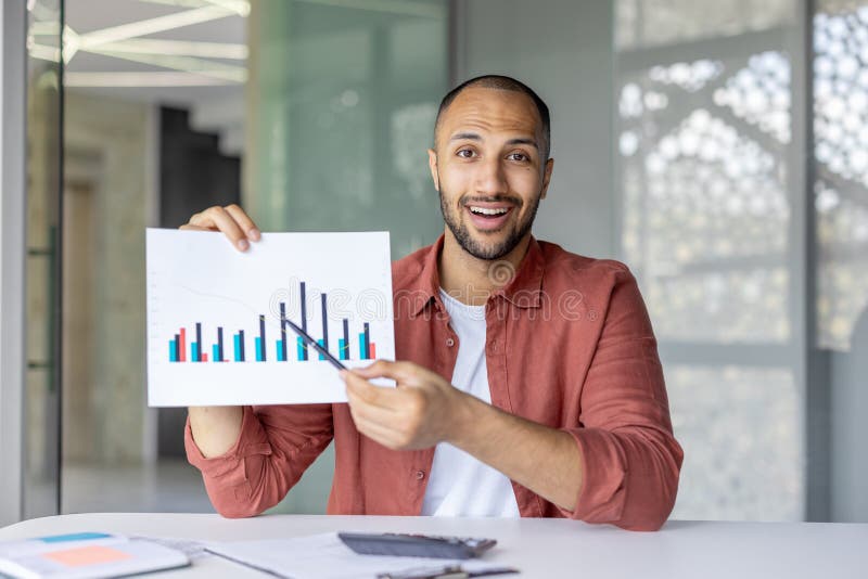 Successful Man with Document, Graph, Report Looking at Camera, Showing ...
