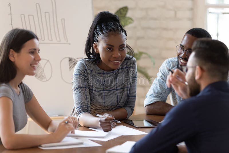 Successful Mixed Race Group of Managers Working Together at Office ...