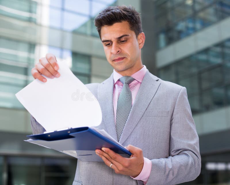 Serious Manager Reading Papers Stock Photo - Image of leadership ...