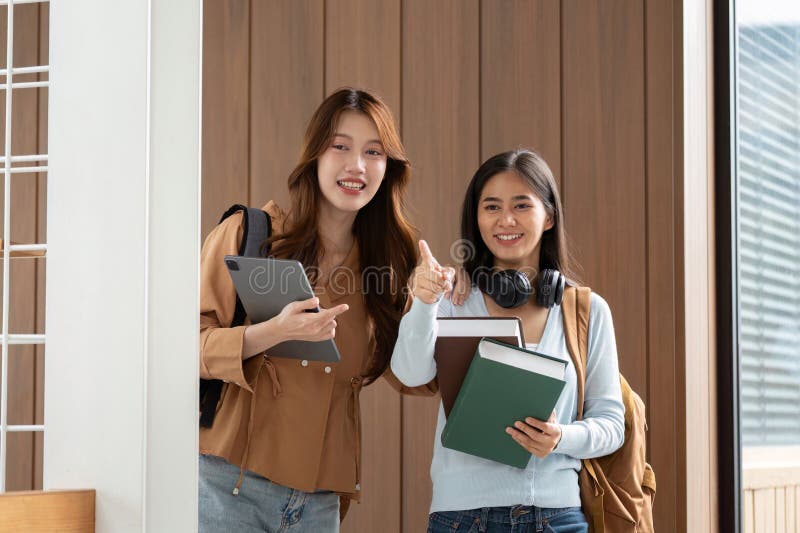 Friendship and Academic Success. Two Students Posing with Their Books ...