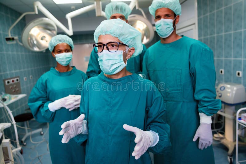 Successful Team of Surgeon Standing in Operating Room, Ready To Work on ...