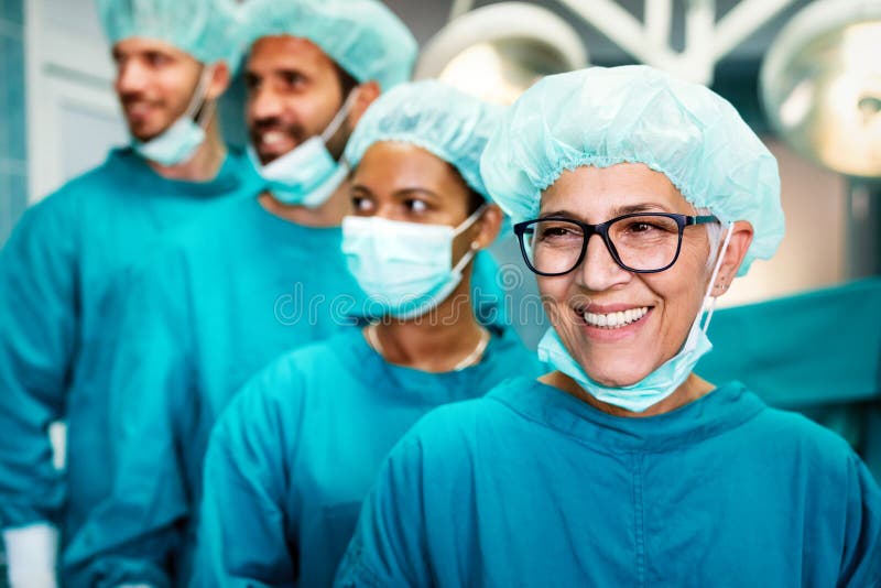 Successful Team of Surgeon Standing in Operating Room, Ready To Work on ...