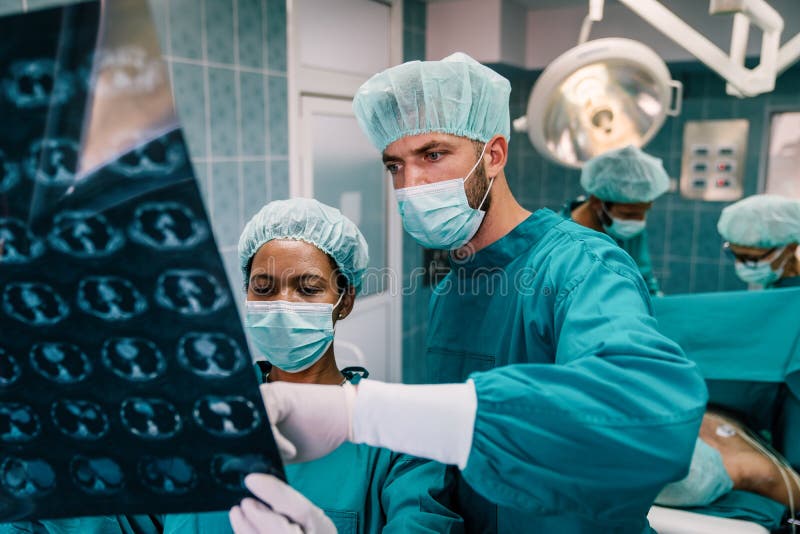 Successful Team of Surgeon Standing in Operating Room, Ready To Work on ...