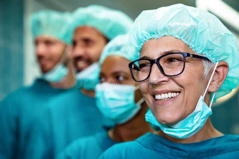 Successful Team of Surgeon Standing in Operating Room, Ready To Work on ...