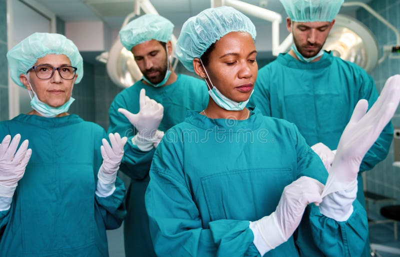 Successful Team of Surgeon Standing in Operating Room, Ready To Work on ...