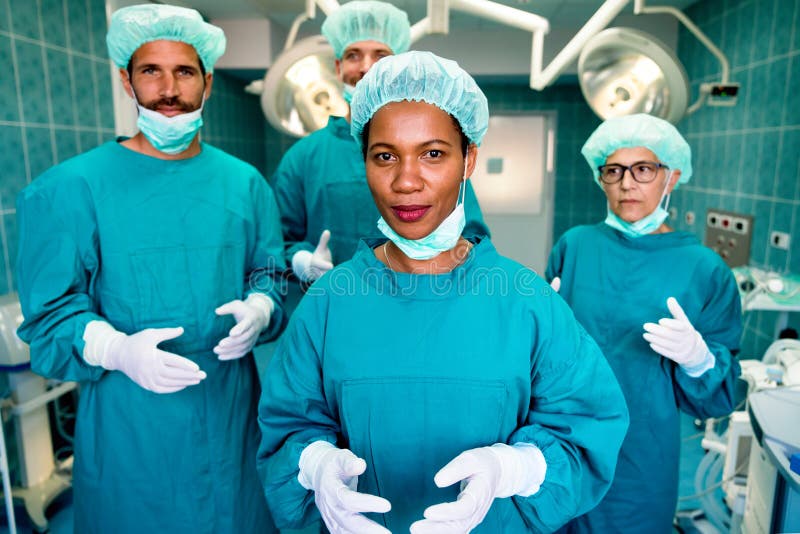 Successful Team of Surgeon Standing in Operating Room, Ready To Work on ...