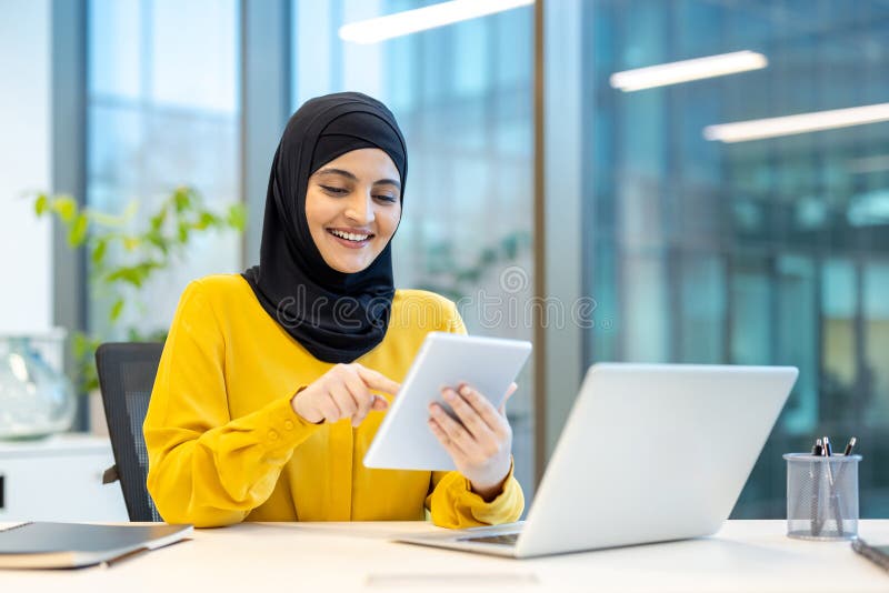 Successful Woman in Hijab Using App on Tablet Computer. Arab Office ...