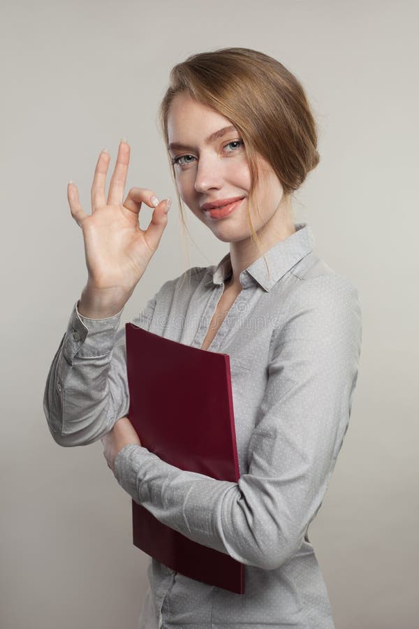 Successful Woman Showing Ok Gesture with Documents on White Stock Photo ...