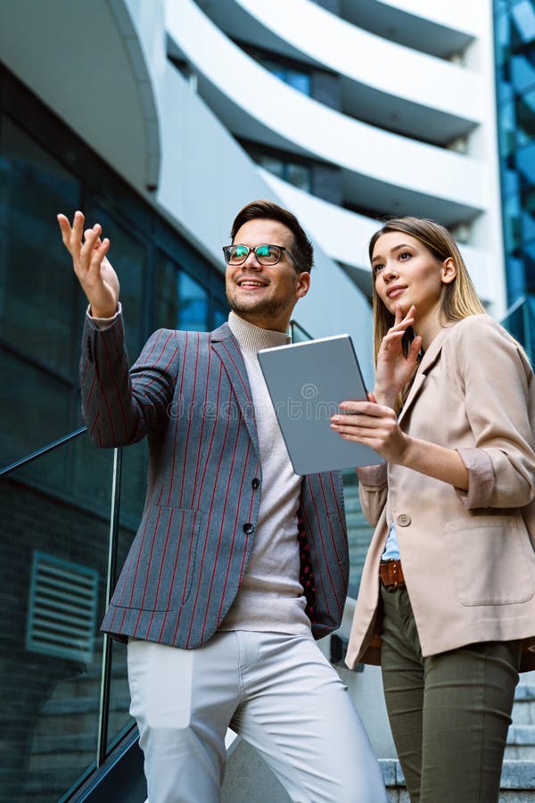 Successful Young Business People Talking, Working Together in Front of ...