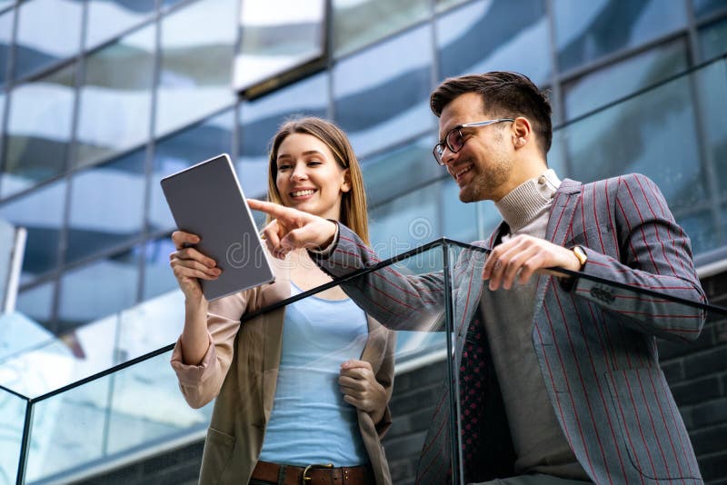 Successful Young Business People Talking, Working Together in Front of ...