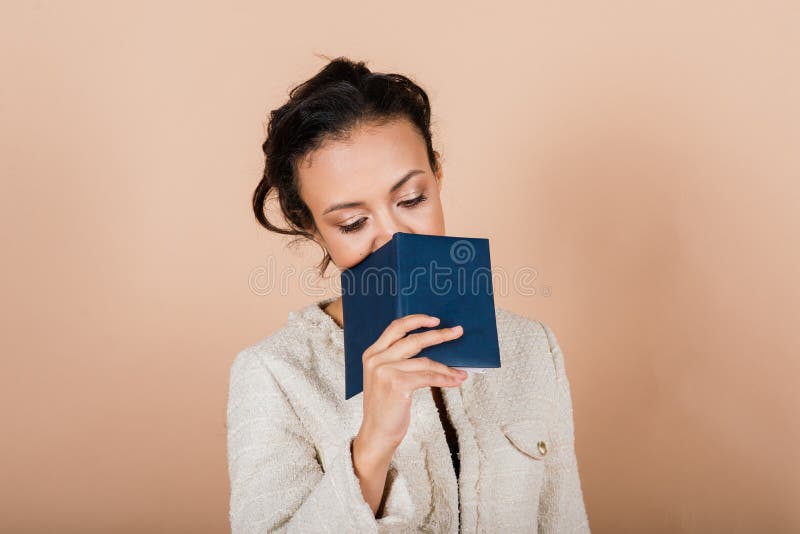 Successful Young Business Woman with Hands Folded Smiling Over Grey ... Successful Young Business Woman with Hands Folded Smiling Over Grey ...