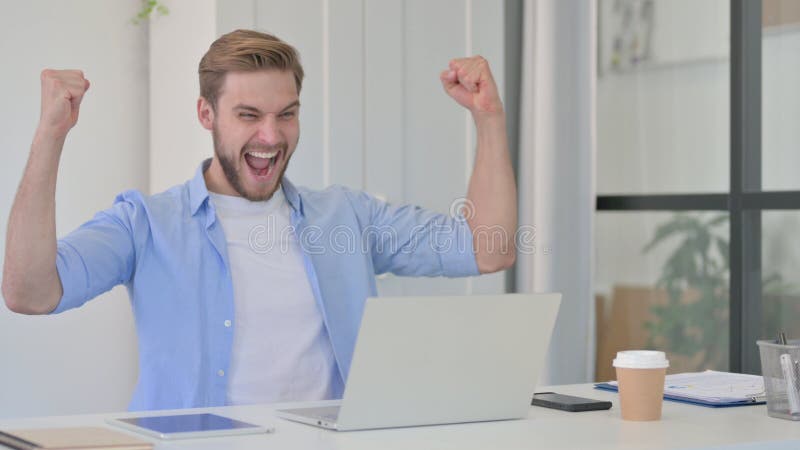Successful Young Man Celebrating on Laptop at Work Stock Image - Image ...