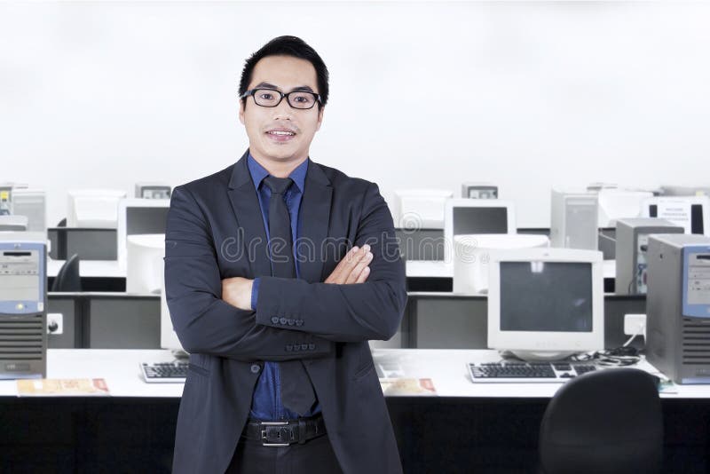 Successful Young Employee Standing in Office Stock Photo - Image of ...