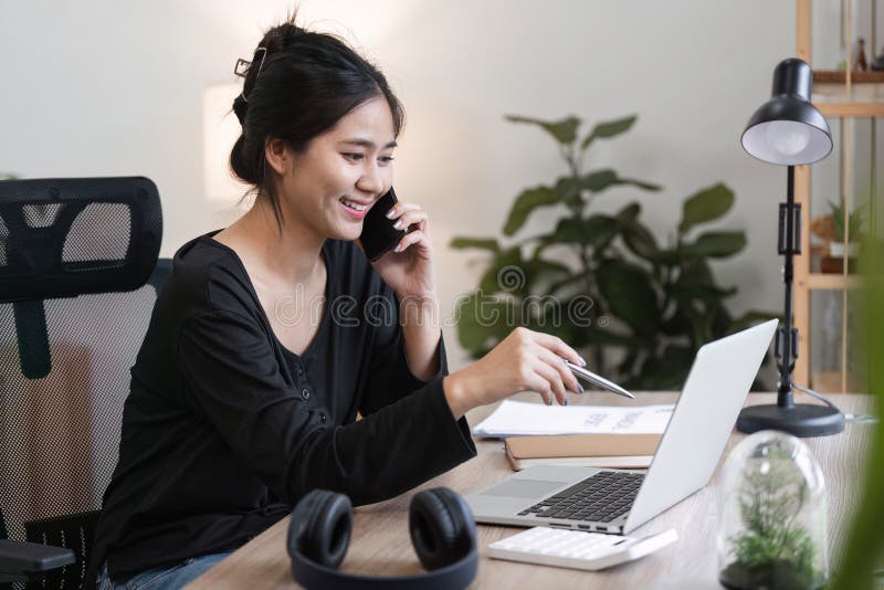 Successful Young Female Accountant Working from Home on Laptop and ...