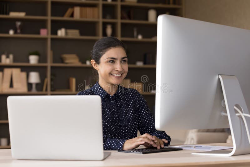 Successful Young Indian Female Work at Desk Using Two Computers Stock ...