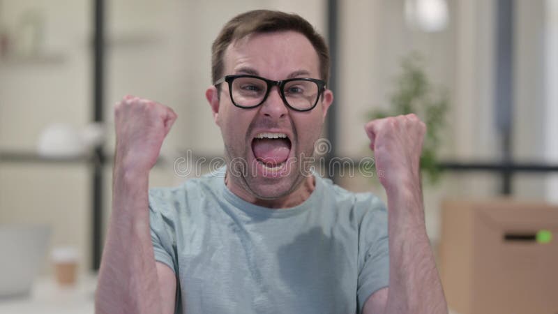 Successful Young Man Celebrating Win Stock Photo - Image of working ...