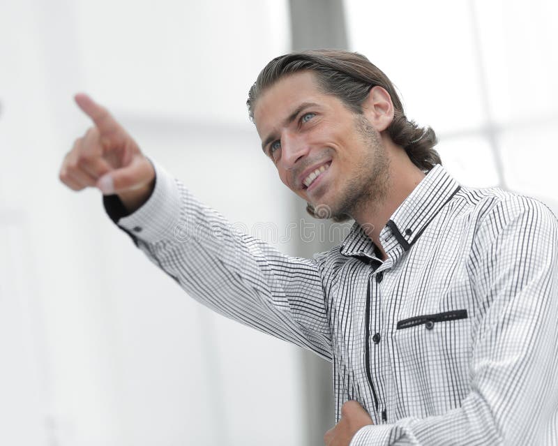 Successful Young Man Pointing Forward Stock Photo - Image of indoors ...