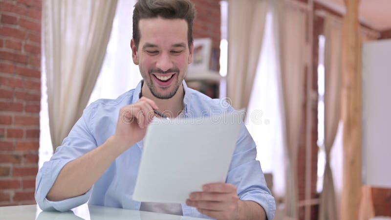 Successful Young Man Reading the Document Stock Image - Image of ...