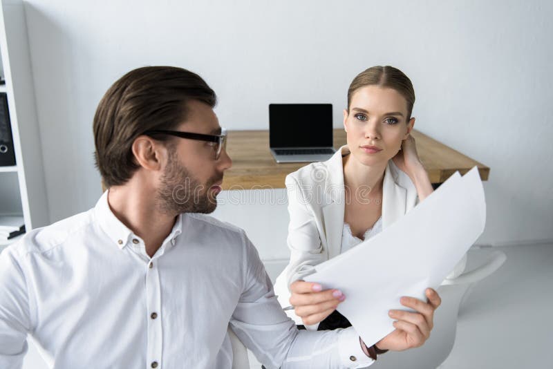 Successful Young Managers Doing Paperwork Together Stock Photo - Image ...
